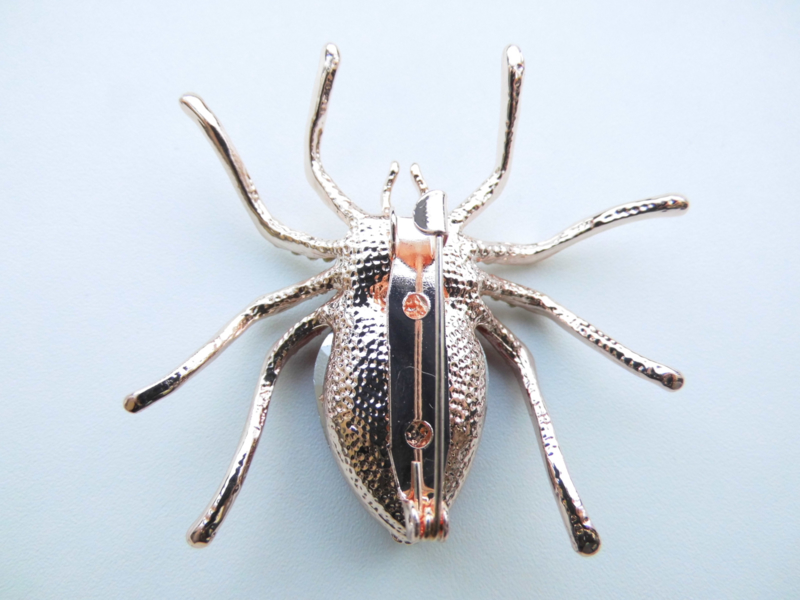 Broche spin met rode steen | Broche's | brochewebshop.nl